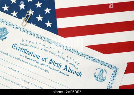 Fs-545 Certification of birth abroad lies on United States flag with ...