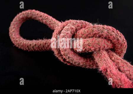 Loop made of thick rope. Loop-shaped knot. Dark background Stock Photo ...