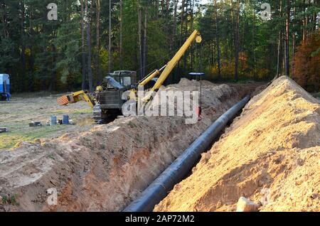 Pipelayer with side boom Installation of gas and crude oil pipes in ...