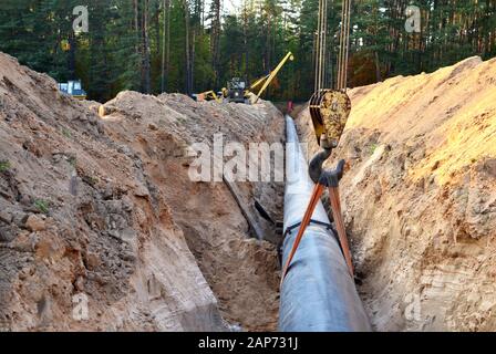 Pipelayer with side boom Installation of gas and crude oil pipes in ...