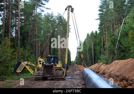 Pipelayer with side boom Installation of gas and crude oil pipes in ...