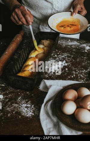 A Woman Prepares Homemade Braided Bread at Home Stock Photo - Alamy