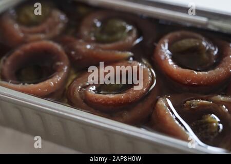 Tin of rolled up anchovies with capers Stock Photo - Alamy