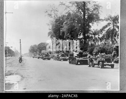 Batavia. Entry British troops with Stuart tanks. On the right a tram ...