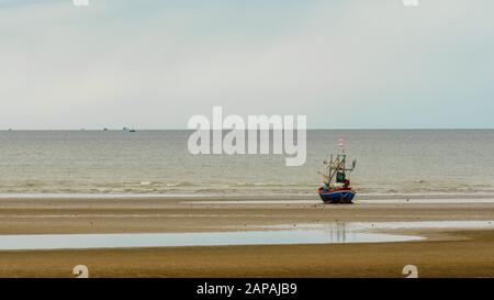 Traditional Thai ishing boats at the beach in Pak Nam Pram, Thailand ...