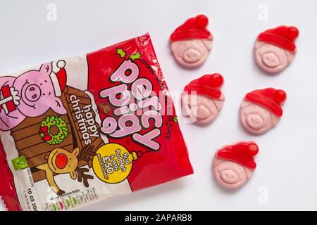 Bag of M&S Percy Pig Festive Helpers sweets made with real fruit juice isolated on white ...