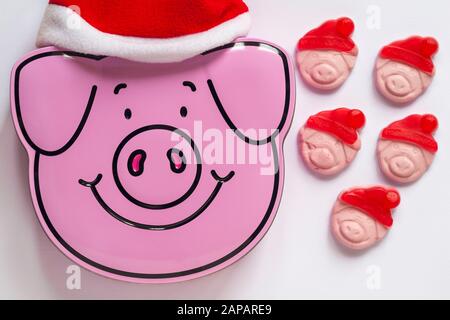 Percy Pigs tin of biscuits wearing Santa hat with Percy Pig biscuits ...