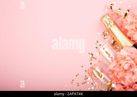 Bottle of wine, rose flowers and hearts on turquoise background ...