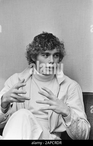 Actor Chris Atkins sitting on a couch during an interview Stock Photo ...