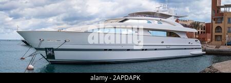 Luxury motor boat anchored in the blue Mediterranean sea with some ...