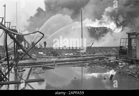 Fire at Shell in Botlek area, the fire brigade in action with foam guns ...