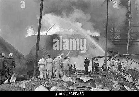 Fire at Shell in Botlek area, the fire brigade in action with foam guns ...