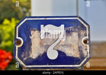 A house number plaque, showing the number seven (7 Stock Photo - Alamy