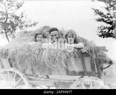 The models Cissy van Bennekom, Grummels and Eva Waldschmidt in a hay ...