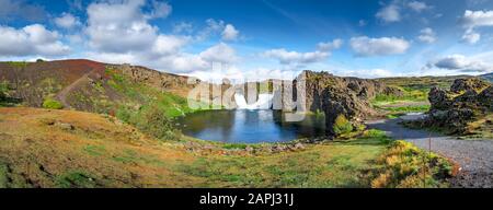 Drone view at Hjalparfoss waterfall on Iceland Stock Photo - Alamy