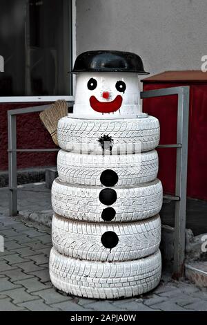 Snowman made from tires Stock Photo - Alamy