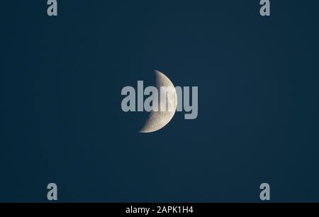 Half moon on dark blue sky background Stock Photo - Alamy