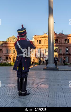 Granadero soldiers lowering the flag in front of Casa Rosada ...