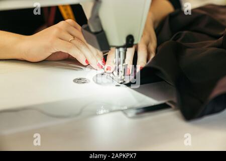 Cropped view of interior designer using smartphone and holding color ...