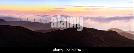 Romantic Sunset and a Wind Turbine Silhouette Stock Photo - Alamy
