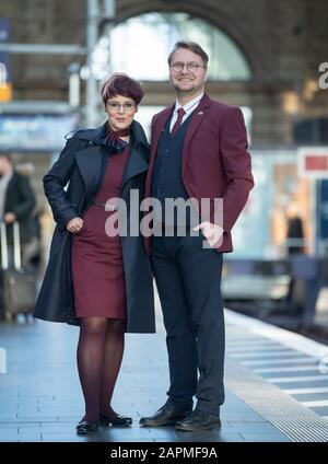 Bus drivers in new uniforms stand next to the new special buses for ...