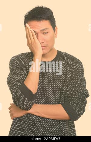 close up shot of exhausted or tired gamer rubbing his eyes while ...