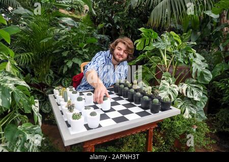 Staff member Callum Munro-Faure poses during a preview for the Giant ...