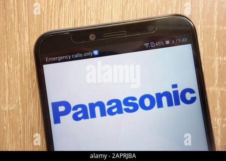 Panasonic logo is displayed on smartphone. Panasonic Holdings ...