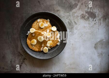 Coconut banana pancakes Stock Photo - Alamy