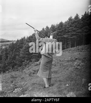 Grouse hunting on Skye Hunting. Woman shooting with a shotgun on the ...