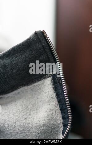 Vertical illustration of a black jacket with a zipper on an isolated ...