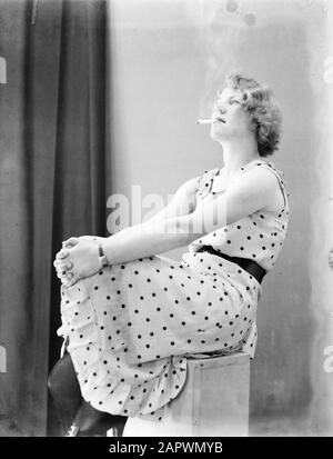 Reportage model Model Eva Waldschmidt poses near a car and cleans her ...