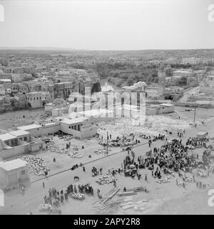 View of the cattle market of Hama from the tell in the background the ...
