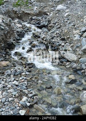 Vertical shot of rocks in the water Stock Photo - Alamy