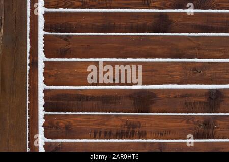 Wooden fence background with snow lying on the boards Stock Photo - Alamy