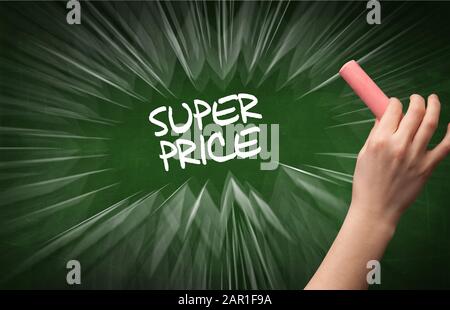 Hand drawing SUPER PRICE inscription with white chalk on blackboard ...