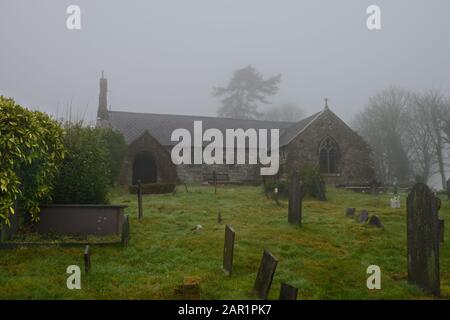 St Beuno's Church in Trefdraeth, Anglesey, here seen in the mist, is a ...
