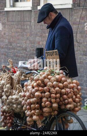 French onion seller (Johnny Onions) with strings of onions tied to his ...