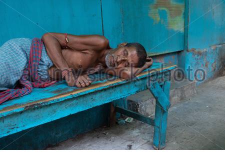 A west Indian man on a bench showing abnormal social behavior Stock ...