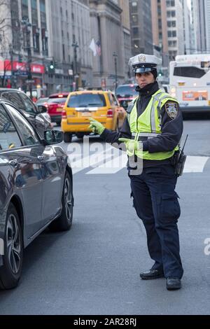 A NYPD Traffic cop directs cars in Times Square, New York City, NY, USA ...