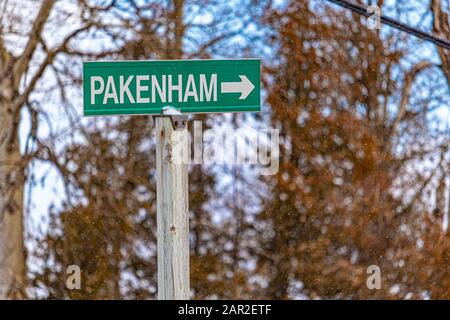 A sign on the highway points the way to the Naval Air Station. Base ...