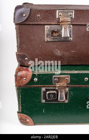 Old destroyed suitcases. Trunks used during long journeys. Dark ...