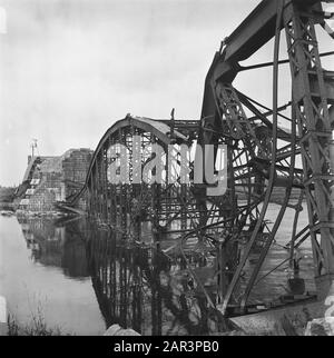 Destruction: Rhenen Destroyed road bridge. With a handcart women and ...