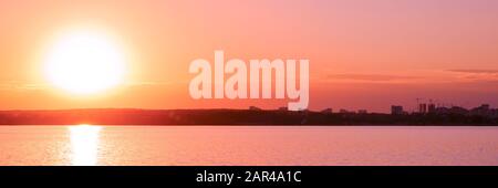 Bright orange sky over lake Pfaeffikon. Summer sunset in Switzerland ...