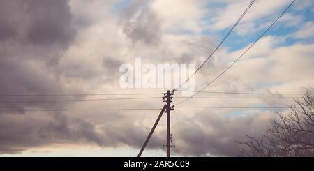 Electrical power lines form a triangle over a modern utility pole Stock ...