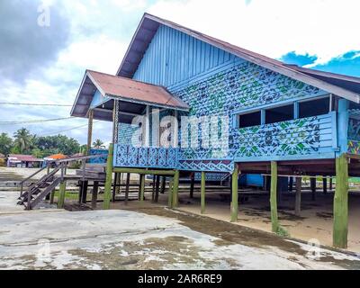Dayak Lundayeh traditional house with tribal painting. Dayak is native ...