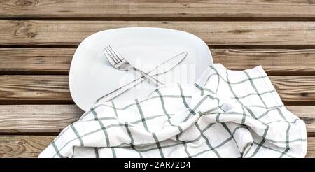 Perspective view of empty light plate on wooden background. Empty space ...