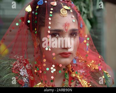 Attractive young Nepali Chhetri woman smiles and looks over her ...