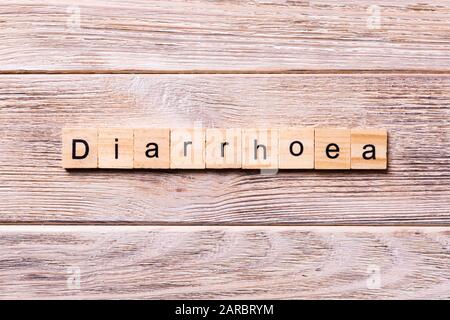 Diarrhoea disease. Written on wooden surface. On wood and medicine ...