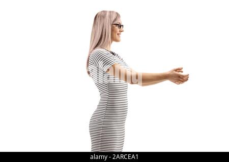 Young blond woman waiting to receive something and gesturing with hands ...